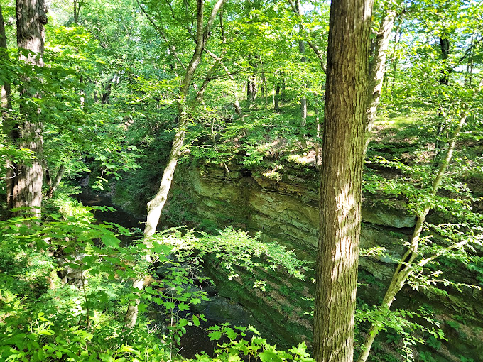 Steep canyon walls frame a hidden paradise. It's like finding Narnia in your own backyard, minus the talking lions.