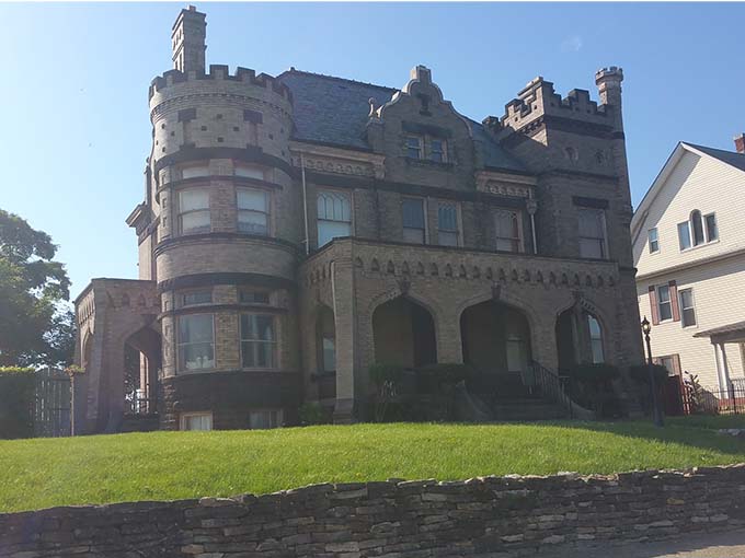 Morning light accentuates the inn's distinctive tower and arched windows, showcasing the architectural details that make this building special.