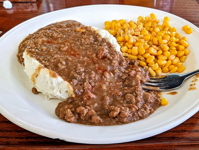 Mashed potato mountain, meet gravy volcano! This plate is a delicious geography lesson in comfort food topography. Explore at your own risk!