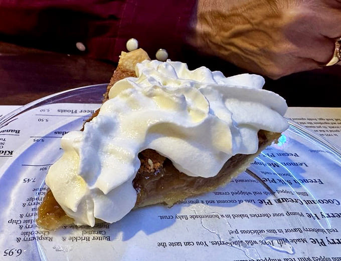 That mountain of whipped cream on this pecan pie isn't just decoration&mdash;it's a delicious necessity.