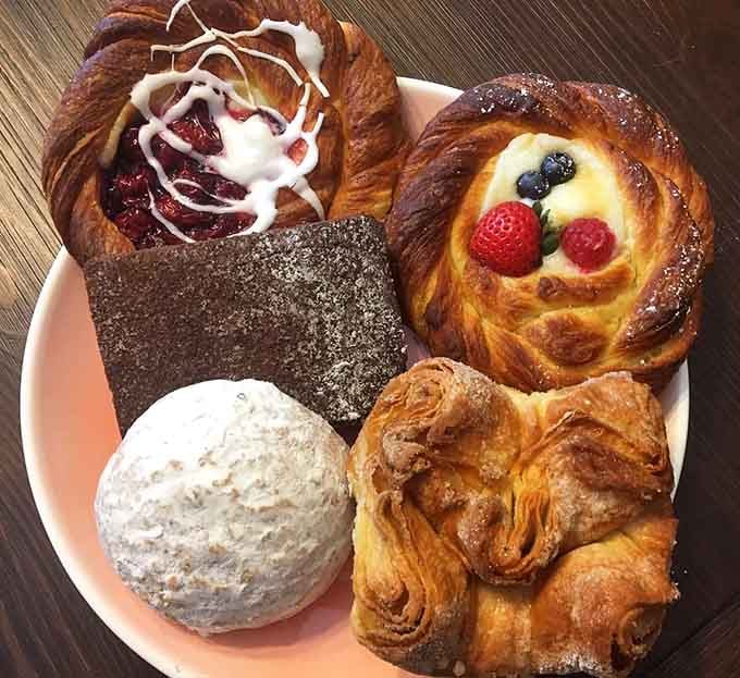 A pastry sampler that looks like the world's most delicious art project, featuring fruit, chocolate, and enough variety to please everyone.
