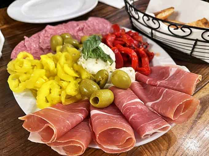 This antipasto platter showcases Italian cured meats and pickled vegetables arranged like edible art you'll feel guilty destroying with your fork.