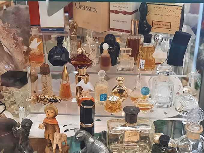 Vintage perfume bottles line up like tiny sculptures, each one a reminder when even fragrance containers were designed to be beautiful.