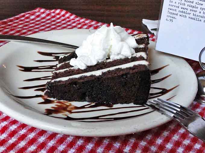 Chocolate cake that means business &ndash; layers of decadence drizzled with sauce and topped with whipped cream that melts into each forkful.