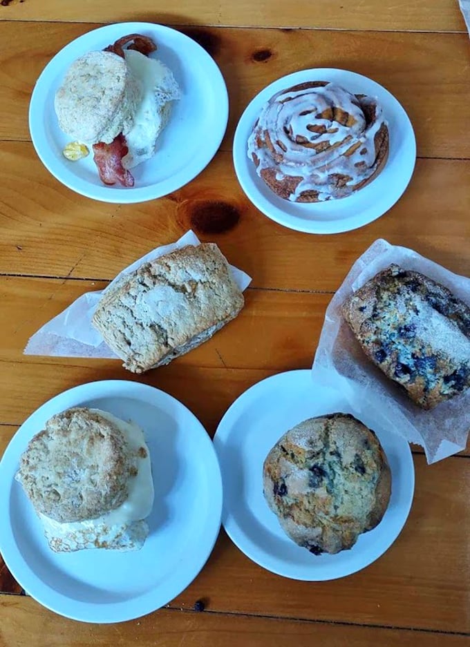 Morning glory on display: sticky buns, breakfast sandwiches, and assorted pastries create a spread that makes decisions deliciously difficult.