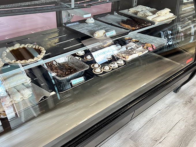 The display case &ndash; where diet plans go to die and happiness begins. A panorama of pastry perfection awaits your selection.