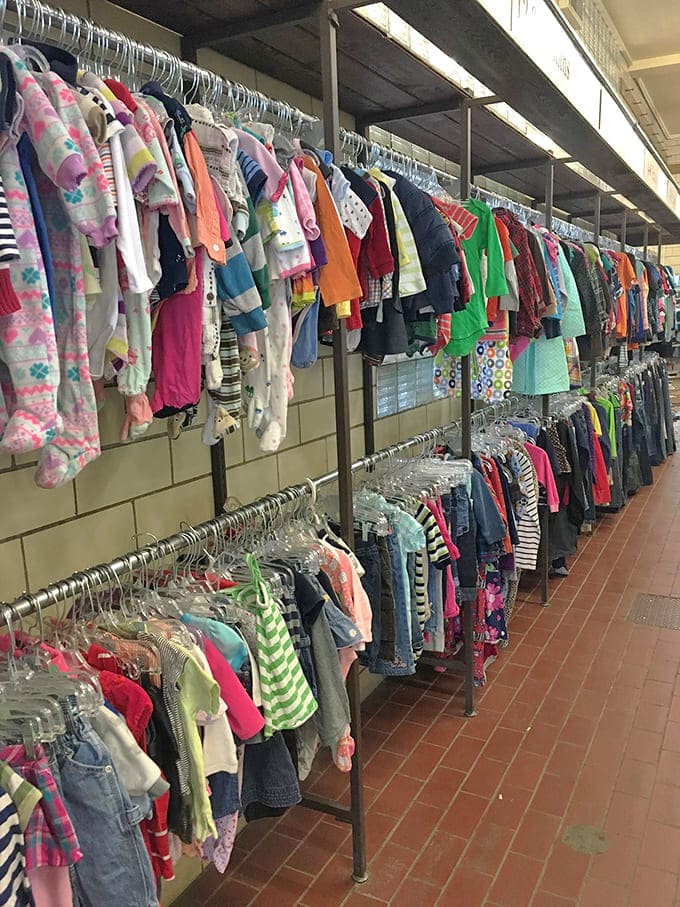 These tiny garments prove that kids grow faster than weeds, making thrift shopping the only financially sane way to keep them clothed.