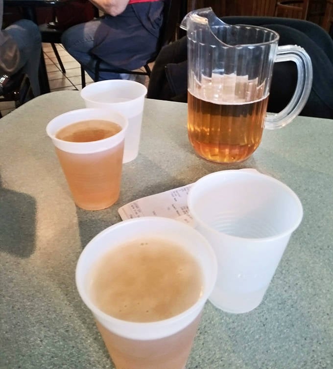 Nothing complements a deep-fried calzone quite like a cold pitcher of beer, a simple pleasure that elevates the entire Jimmy's experience.