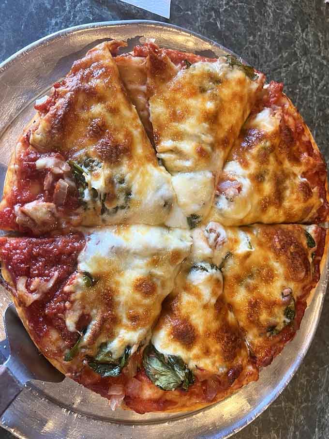 Who says vegetarian pizza can't be exciting? This colorful creation proves that fresh veggies can absolutely steal the show on thin crust.