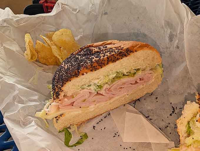 That sesame-studded bun holds together layers of flavor like a delicious edible basket, proving that good bread makes all the difference.