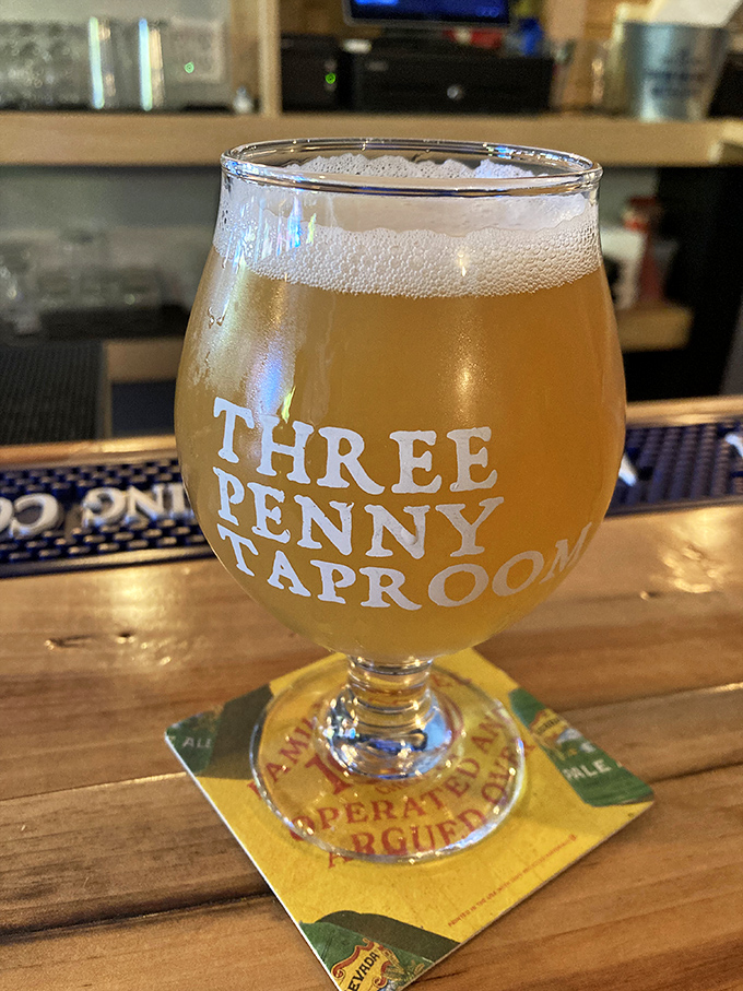 Liquid gold in a glass &ndash; this perfectly poured beer with its delicate head showcases Three Penny's commitment to serving craft brews at their peak.