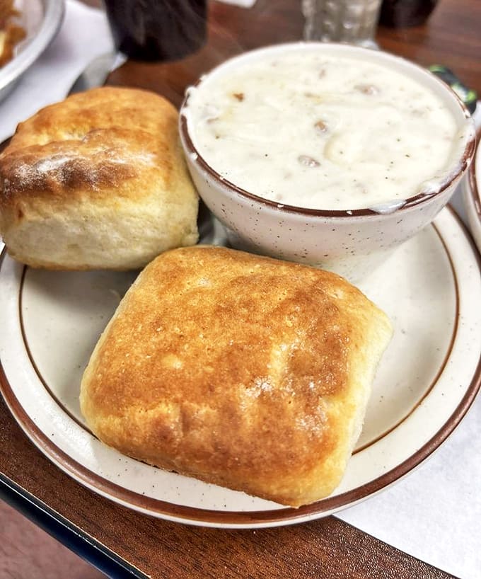 Biscuits and Gravy: Fluffy clouds of dough swimming in a savory sea &ndash; breakfast architecture that would make any Southern grandma proud.