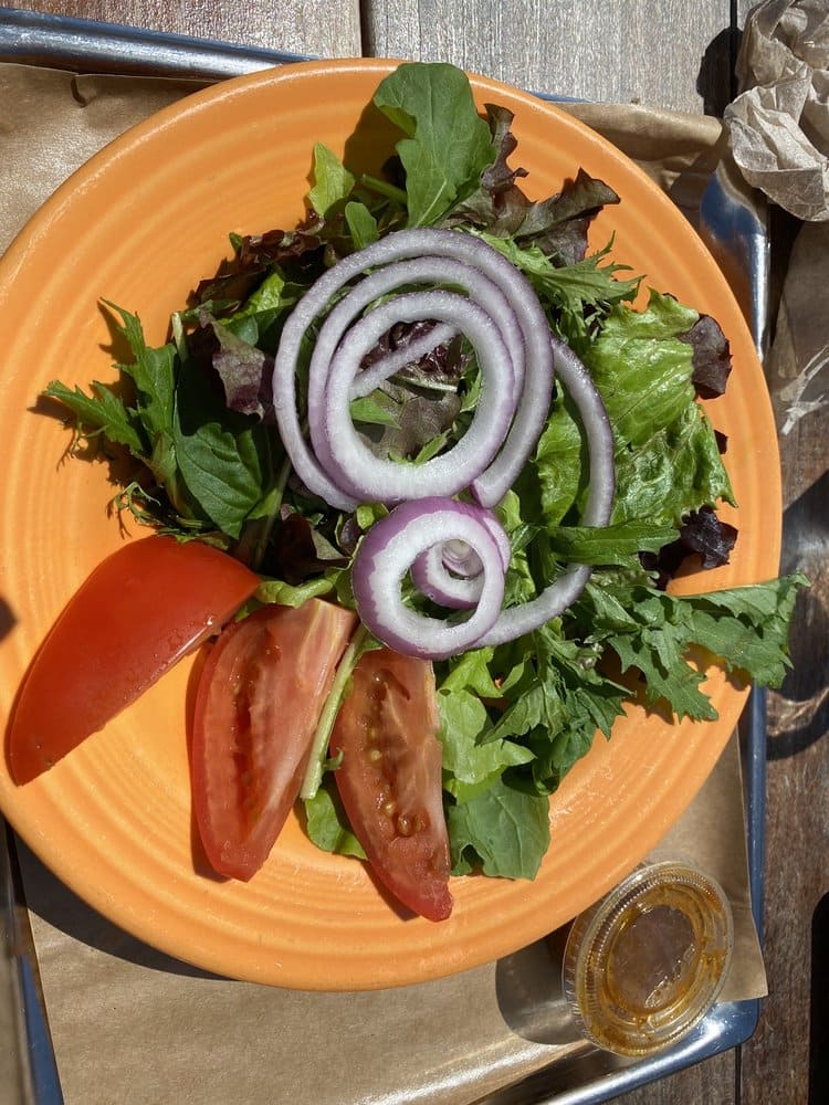 Even the freshest salad can't compete with the allure of those famous fries, though both deserve a place on your table.