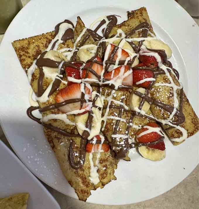 Nutella and strawberries on crepes remind you this place does breakfast just as well as lunch.