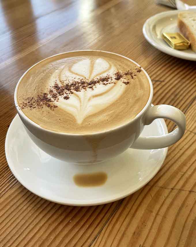 That perfectly poured latte with delicate foam art is almost too beautiful to drink—almost, but not quite, because it tastes even better than it looks.