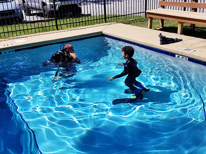 The practice pool offers a safe space for beginners to find their fins before tackling the main attraction.