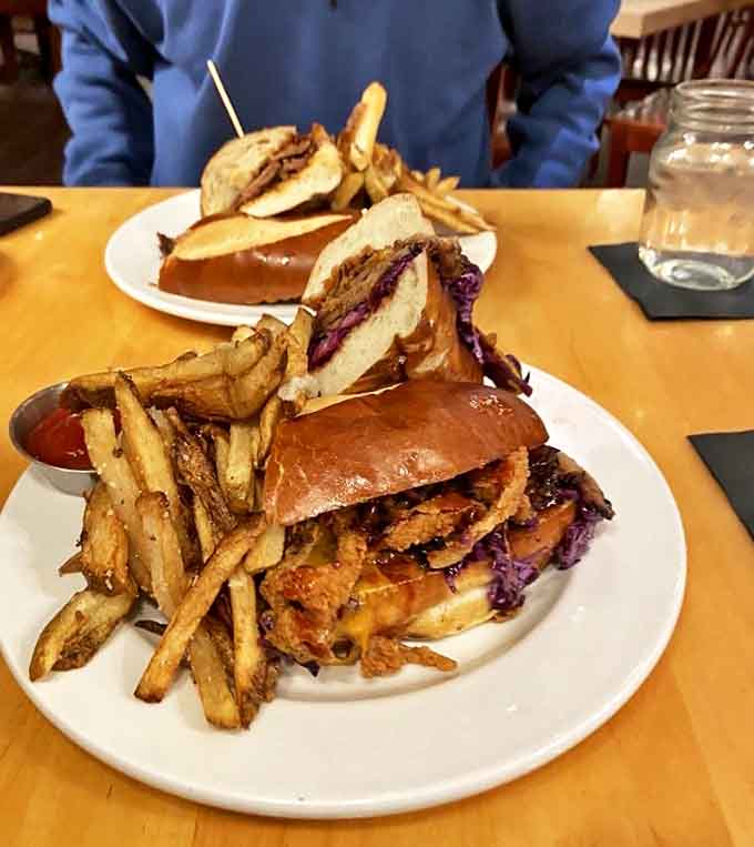 This brisket sandwich towers with smoky meat that required hours of patience and rewards you with every bite.