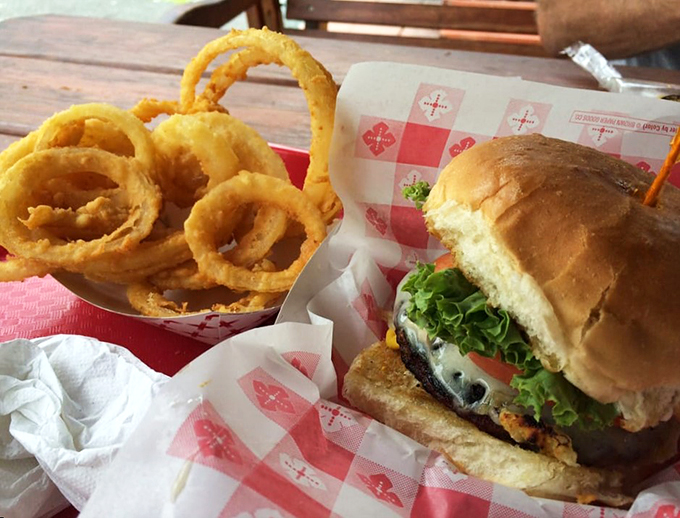Burger bliss achieved! Paired with these crispy onion rings, it's a dynamic duo that'll make your taste buds sing.