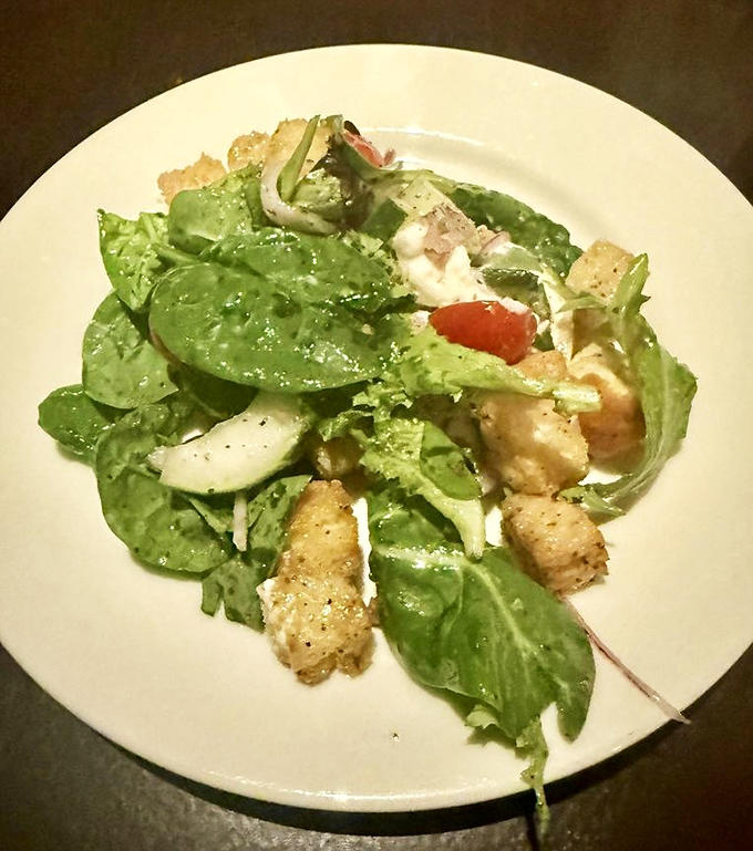 Fresh greens playing host to a gathering of flavors&mdash;each bite of this salad tells a different delicious story.