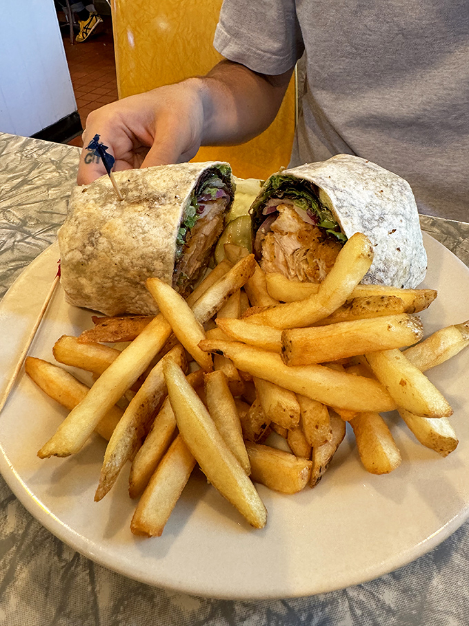 This isn't just any burrito – it's a hand-rolled flavor bomb served with home fries that achieve the perfect balance of crispy exterior and fluffy interior.