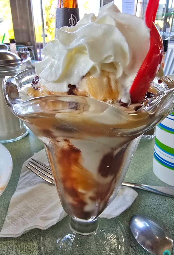 This towering caramel sundae in classic glassware with that perfect cherry on top is basically happiness served in a dish.
