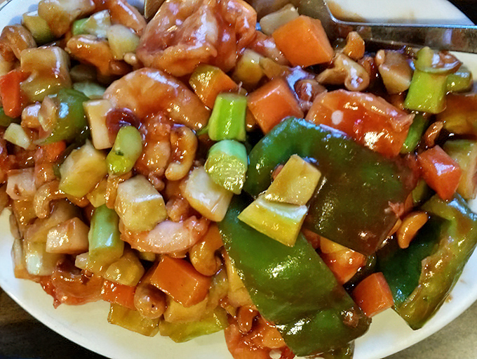 A colorful cashew shrimp dish that dances on the plate &ndash; vibrant vegetables and plump shrimp in perfect proportion.