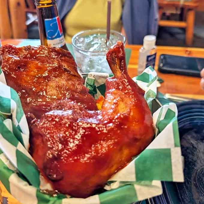 Glistening with house-made BBQ sauce, the smoked chicken showcases the smokehouse's expertise with slow-cooked meats that fall off the bone with tender perfection.