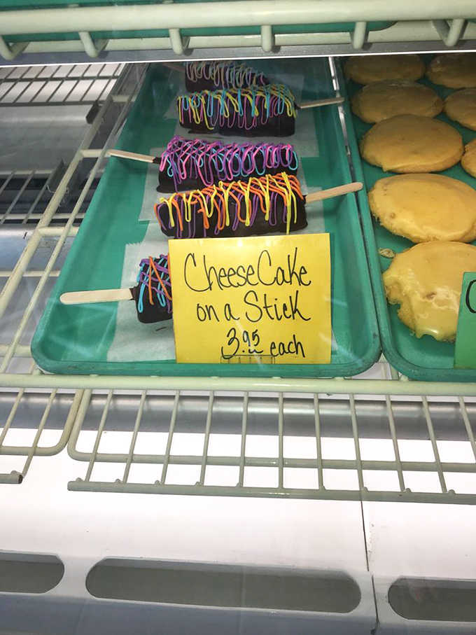 Cheesecake on a Stick: Portable decadence with colorful drizzles – proof that sometimes the best innovations are the simplest ones.