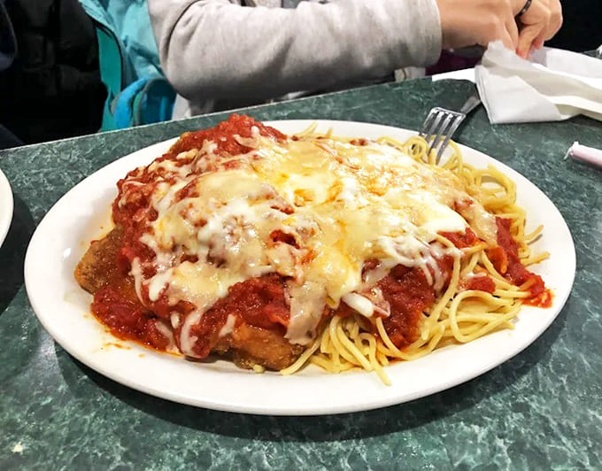 The chicken parmigiana arrives like an edible work of art&mdash;golden breaded cutlet hidden beneath a lava flow of marinara and melted cheese.