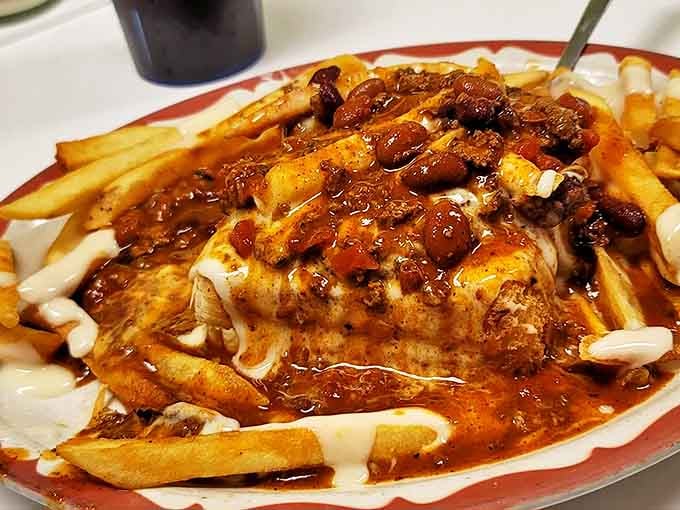 Chili cheese fries taken to their logical extreme, creating a dish that requires both a fork and commitment.