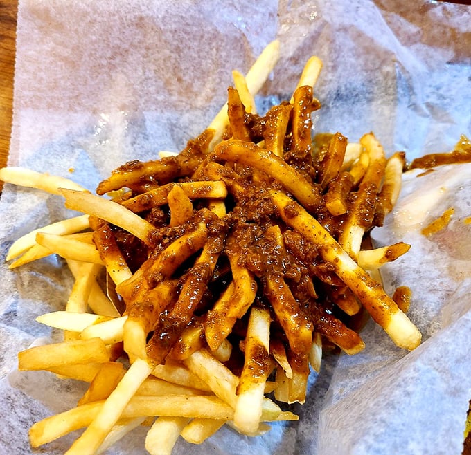 Fries swimming in a sea of chili? It's like Poseidon himself decided to bless your taste buds with savory waves.
