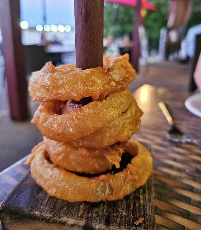 These golden rings stacked on that rustic board look like they're auditioning for a supporting role in your happiness.