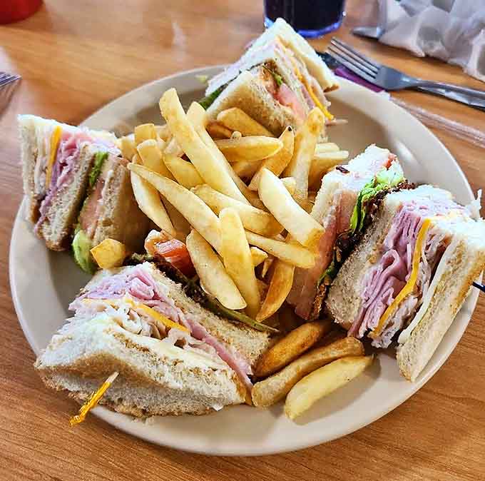 Club Sandwich: A skyscraper of sliced meats, cheese, and veggies that requires both hands and possibly an engineering degree to tackle properly.