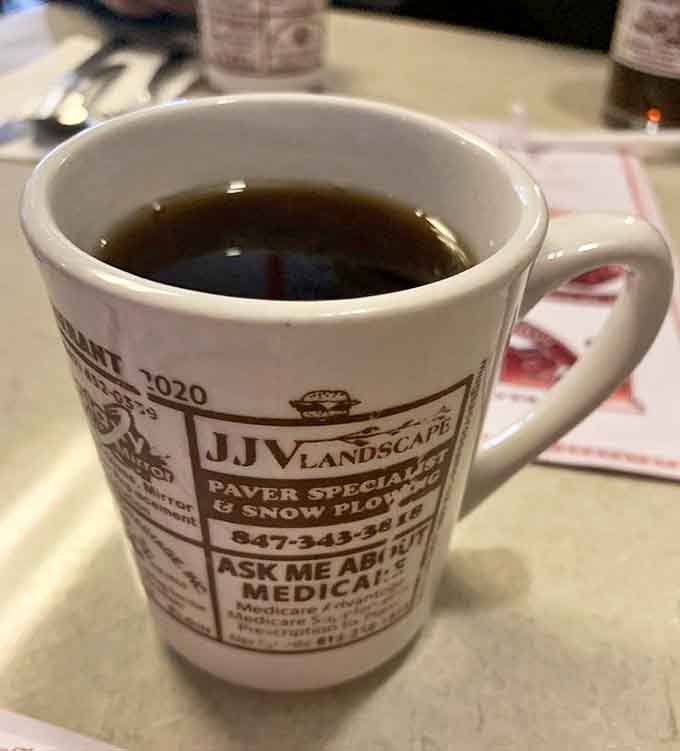 The coffee mug at Ray's doubles as local advertising space &ndash; a charming reminder you're dining somewhere woven into community fabric.