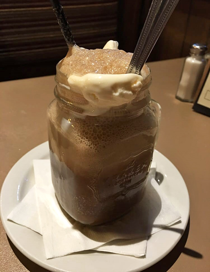 Childhood nostalgia served in a Mason jar &ndash; a root beer float topped with vanilla ice cream slowly melting into fizzy sweetness below.