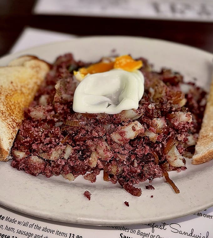 Corned beef hash that would make your grandmother weep with joy, topped with a dollop of sour cream and ready for your fork's attention.