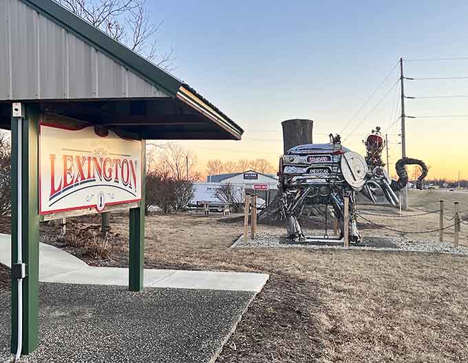 The welcome sign seems almost understated next to its metallic neighbor, as if saying "Oh, and we also have a giant elephant."