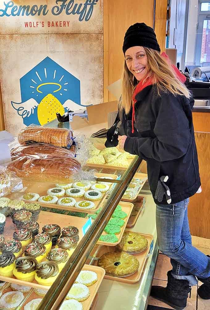 A customer contemplates life's most important decision: which of Wolf's legendary treats will be coming home today?