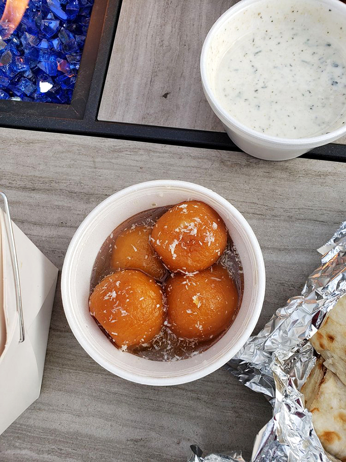 Gulab jamun: where donut holes go for their glow-up! These syrupy spheres of joy are sweeter than a Packers' Super Bowl victory. 
