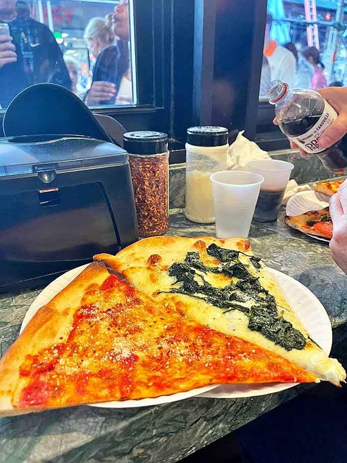 A trio of temptation: plain, pepperoni, and spinach slices demonstrate the beautiful versatility of New York-style pizza &ndash; which would you choose first?