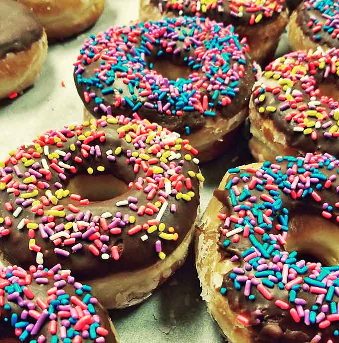 Childhood nostalgia in edible form, proving that sometimes happiness is as simple as colorful sprinkles on chocolate frosting.