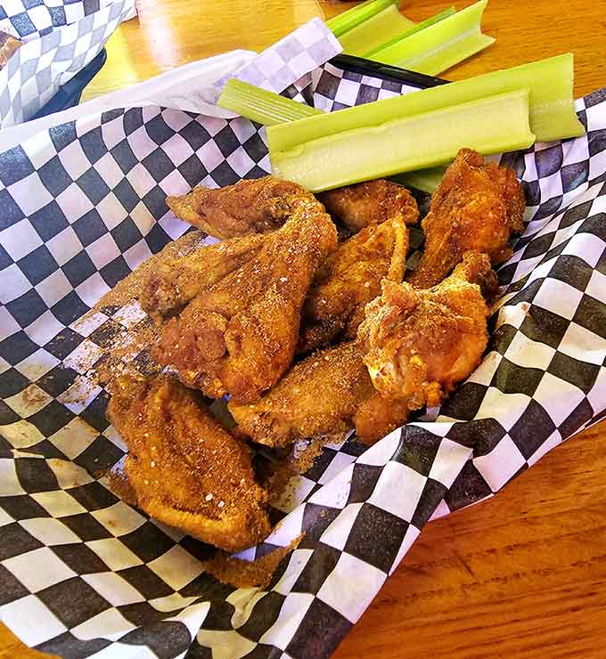 Golden, crispy wings arrive ready to test your heat tolerance and reward your bravery with serious flavor.