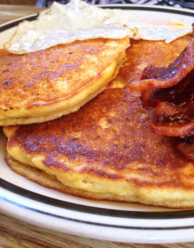 Corn cakes golden and gorgeous, proving that sometimes the best menu items are the ones you didn't know you needed until they're sitting in front of you.