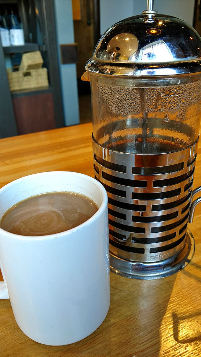 The French press delivers liquid motivation alongside your bagel &ndash; because every great breakfast deserves an equally impressive coffee companion.