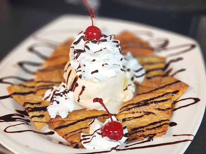 Fried ice cream defies physics and logic, somehow staying frozen inside its crunchy shell while looking absolutely Instagram-worthy.