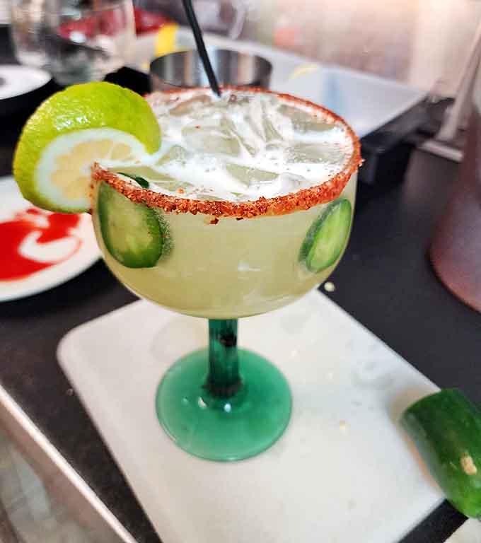 A properly made margarita with cucumber garnish is the perfect companion to your meal and your afternoon.