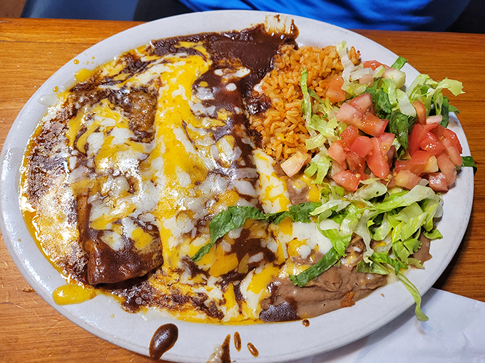 Southwestern flavors take center stage with these enchiladas &ndash; smothered in sauce and cheese with rice and fresh veggies.