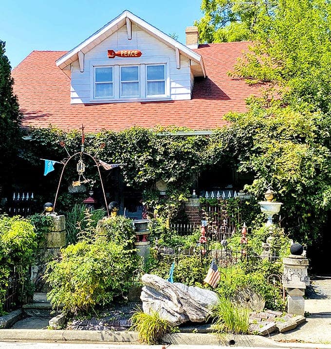 The welcoming facade of the modest home belies the extraordinary sanctuary behind it, where "PEACE" isn't just a word but a living philosophy.