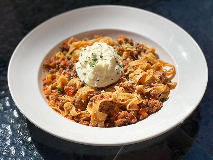 Pasta perfection that would make an Italian nonna proud. This fettuccine Bolognese is topped with a cloud of ricotta so light, it might float right off your plate.