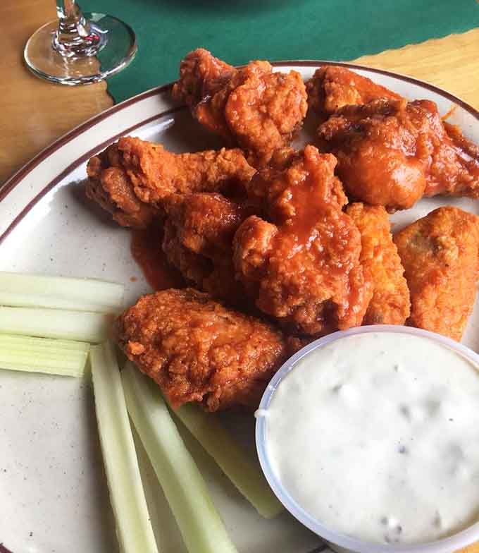 Buffalo wings arrive hot and saucy, the kind of appetizer that disappears faster than you can say "order another round."